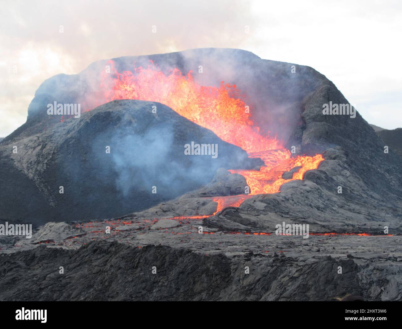 Shot of lava erupting at the volcano - Natural disaster Stock Photo - Alamy