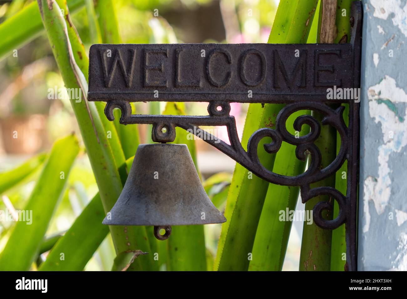 Metallic bell with the text welcome Stock Photo - Alamy