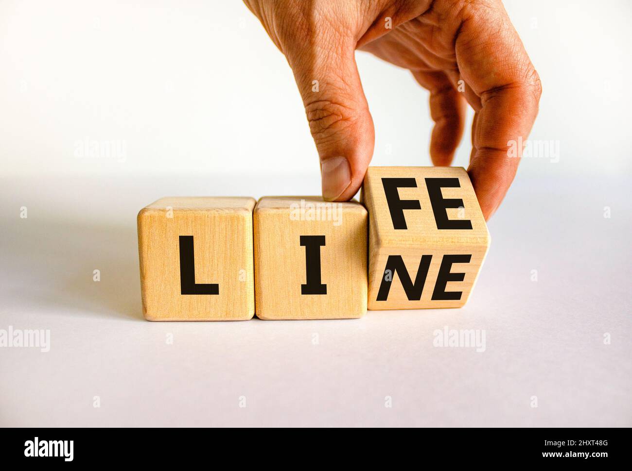 Lifeline, line of life symbol. Businessman turns the wooden cube and ...