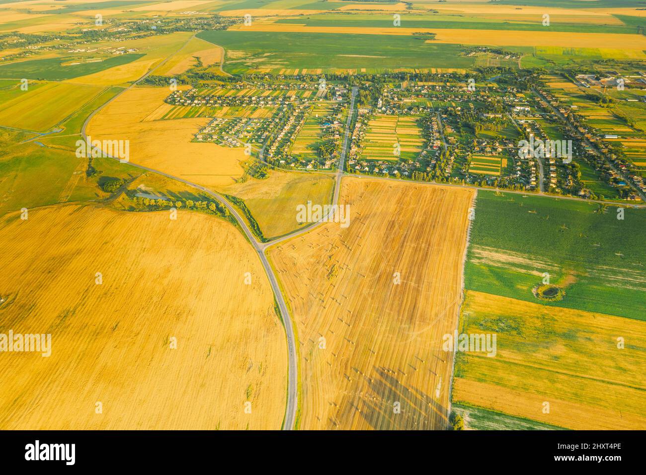 Aerial View Of Village And Hay Rolls, Straw Field Landscape In Summer ...