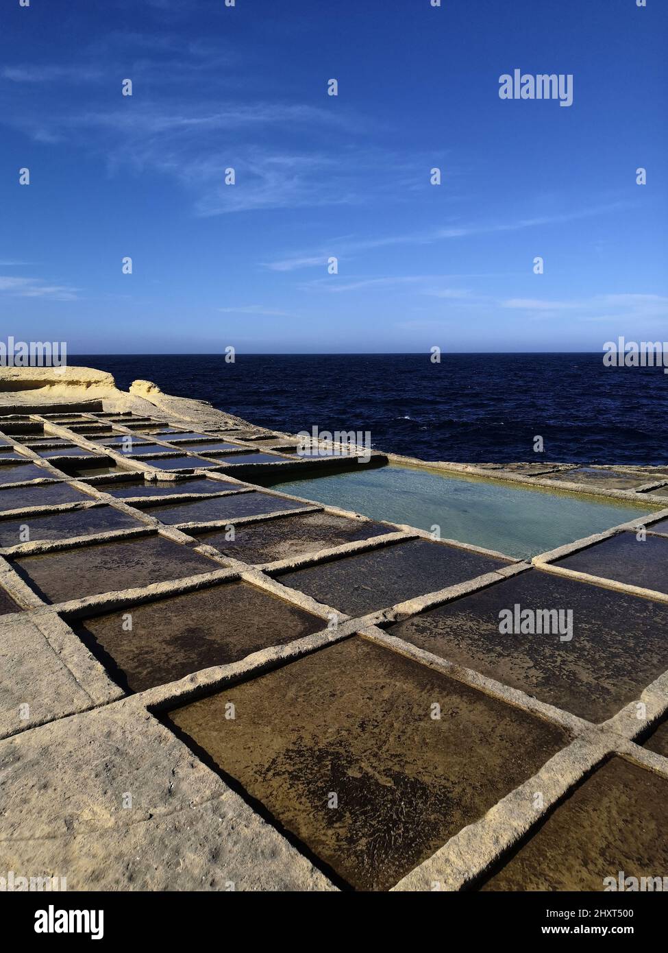 Sea salt pans on the Maltese Island of Gozo Stock Photo - Alamy