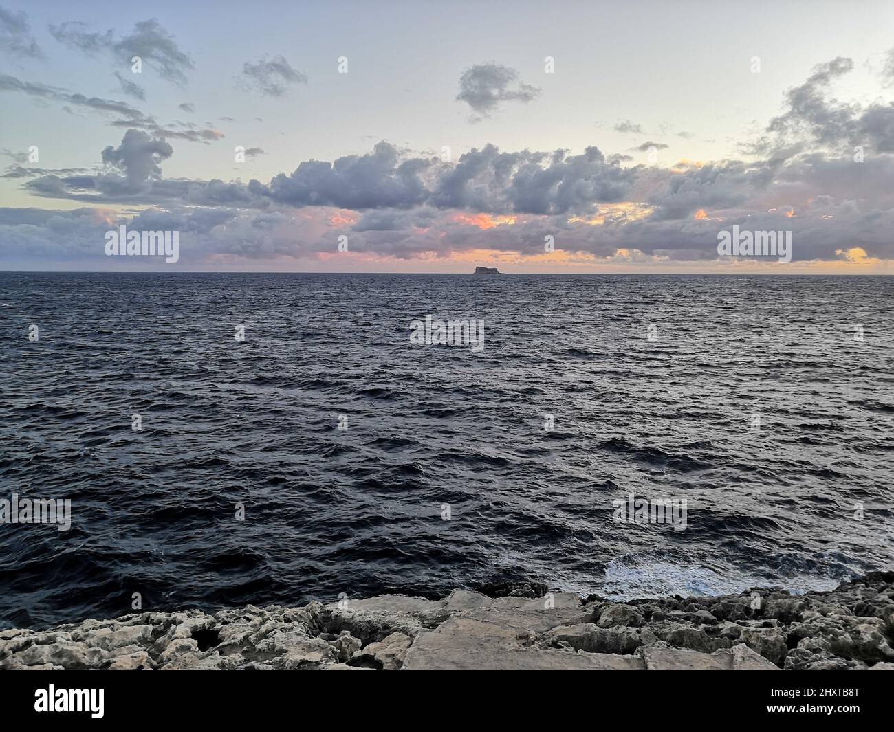 Beautiful wallpaper of the wavy sea and the shore under the cloudy sky ...