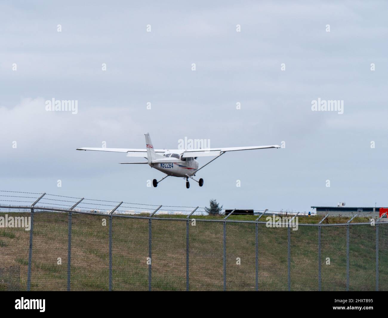 Cessna 172 aircraft landing in an airport Stock Photo - Alamy