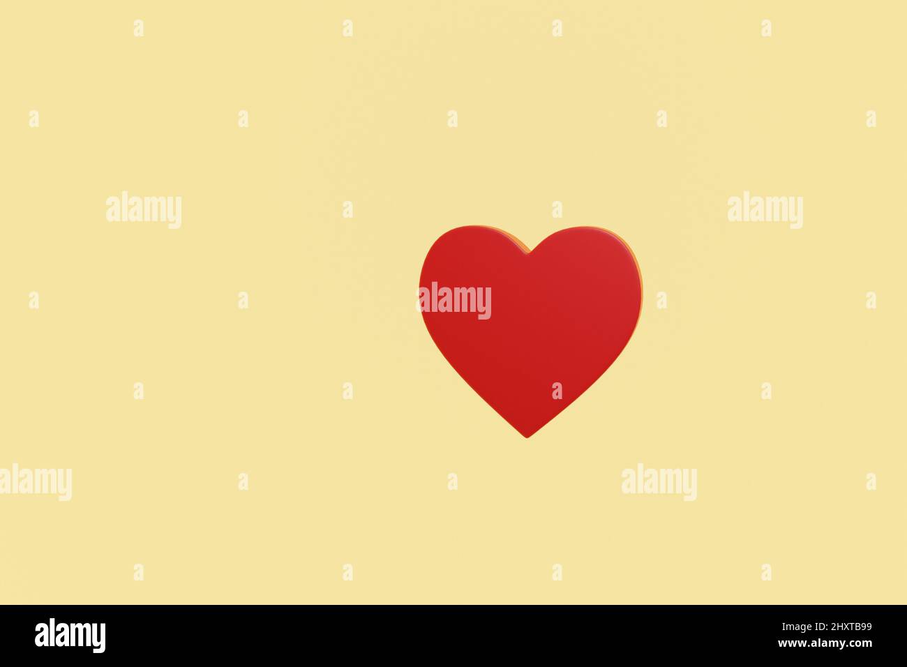 red heart 3d rendering on yellow background Stock Photo - Alamy