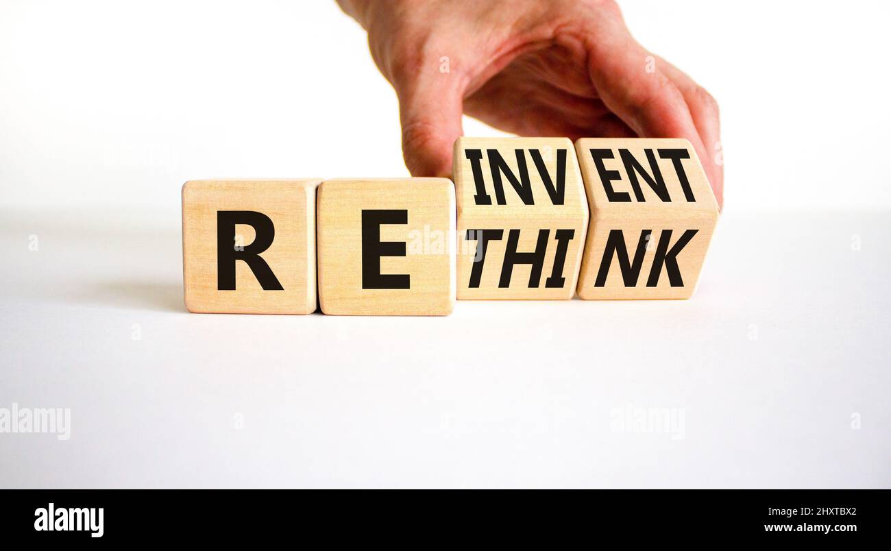 Reinvent and rethink symbol. Businessman turns cubes and changes the ...