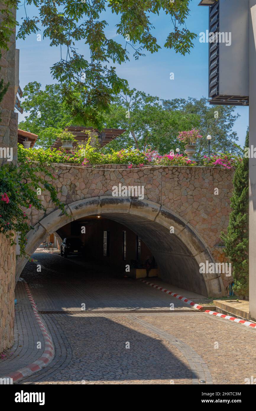 Vertical photo of a road and stone tunnel to Castello Di Bellagio in ...