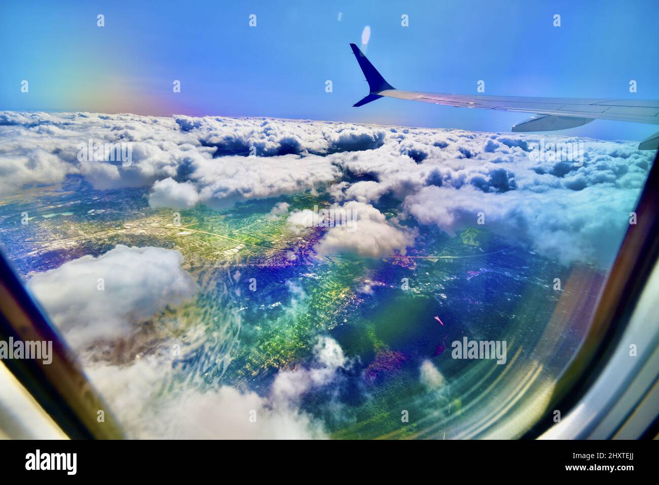 Beautiful view from the airplane window on the skyline with clouds and ...