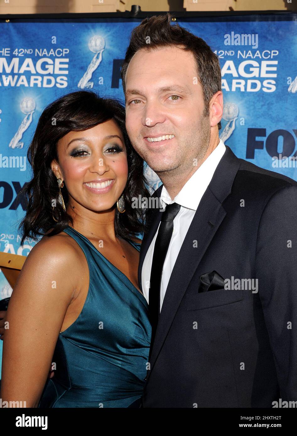 Tamera Mowry and Adam Housley arriving at The 42nd NAACP Image Awards ...