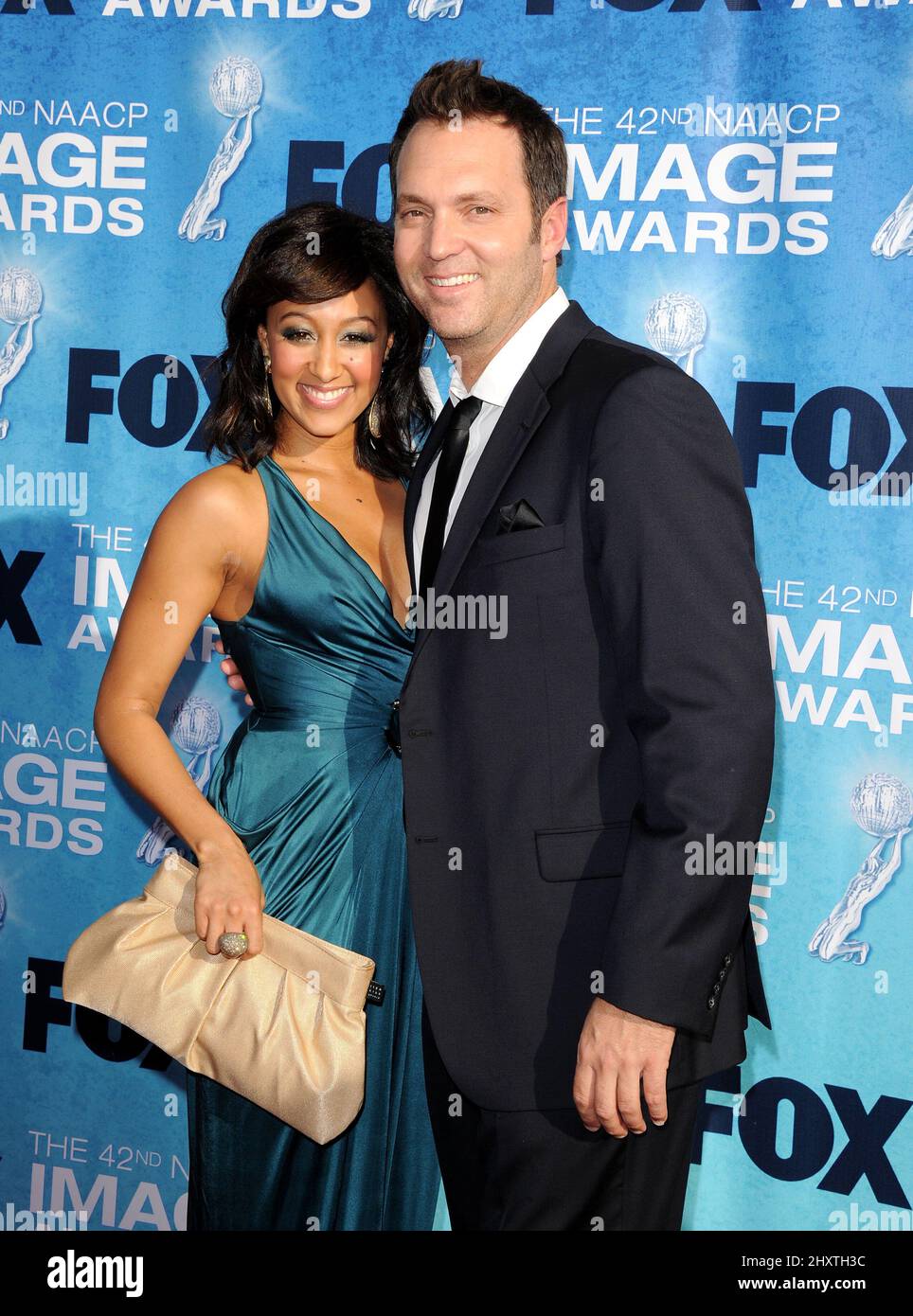 Tamera Mowry and Adam Housley arriving at The 42nd NAACP Image Awards ...