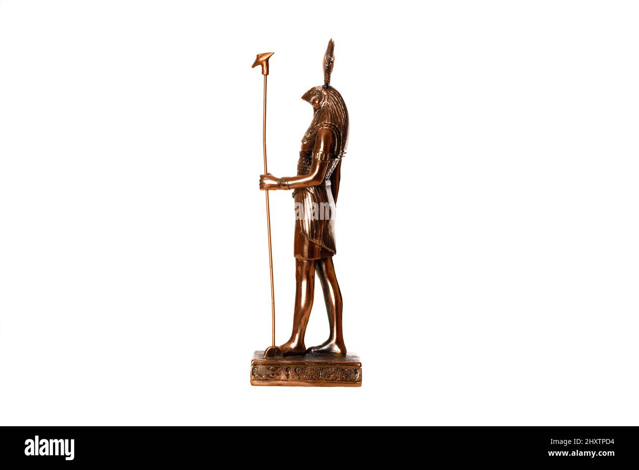 figurine of the god Ra with the head of a falcon isolated on a white ...