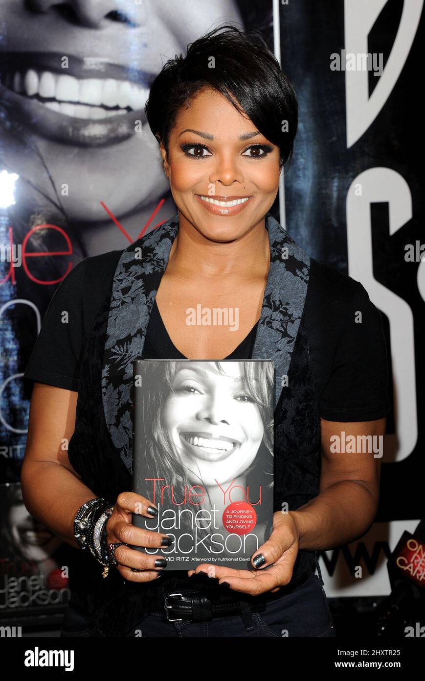 Janet Jackson signs her new book "True You: A Journey to Finding and ...