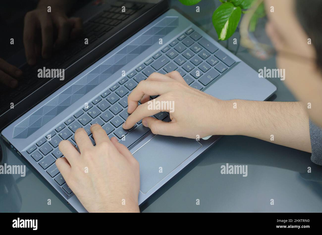 Overhead shot of a person typing on a laptop, working from home Stock ...