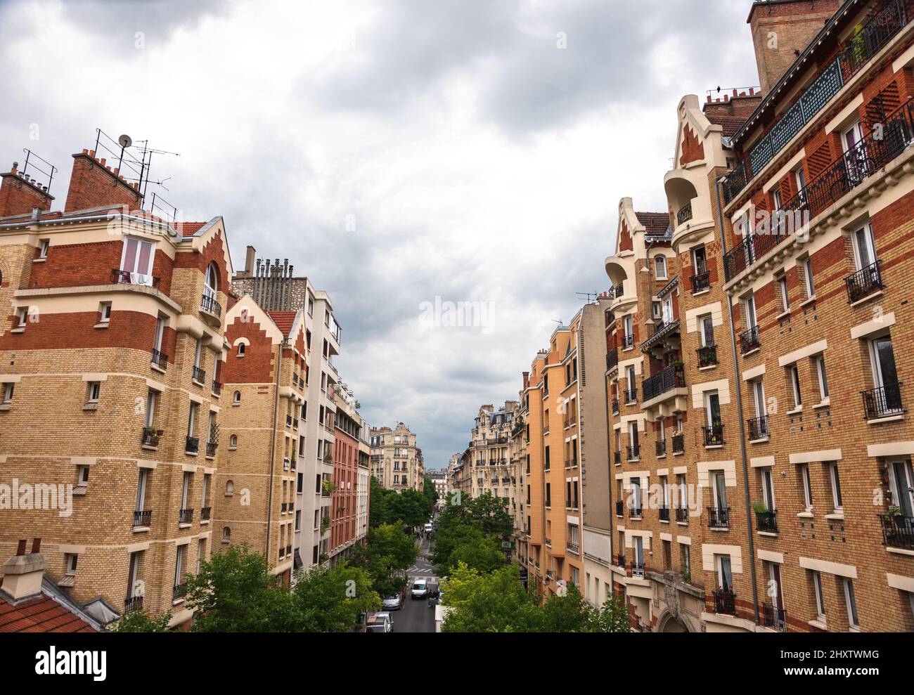 PARIS, FRANCE - JUNE 14, 2018: Red brick buildings at Parisian street ...