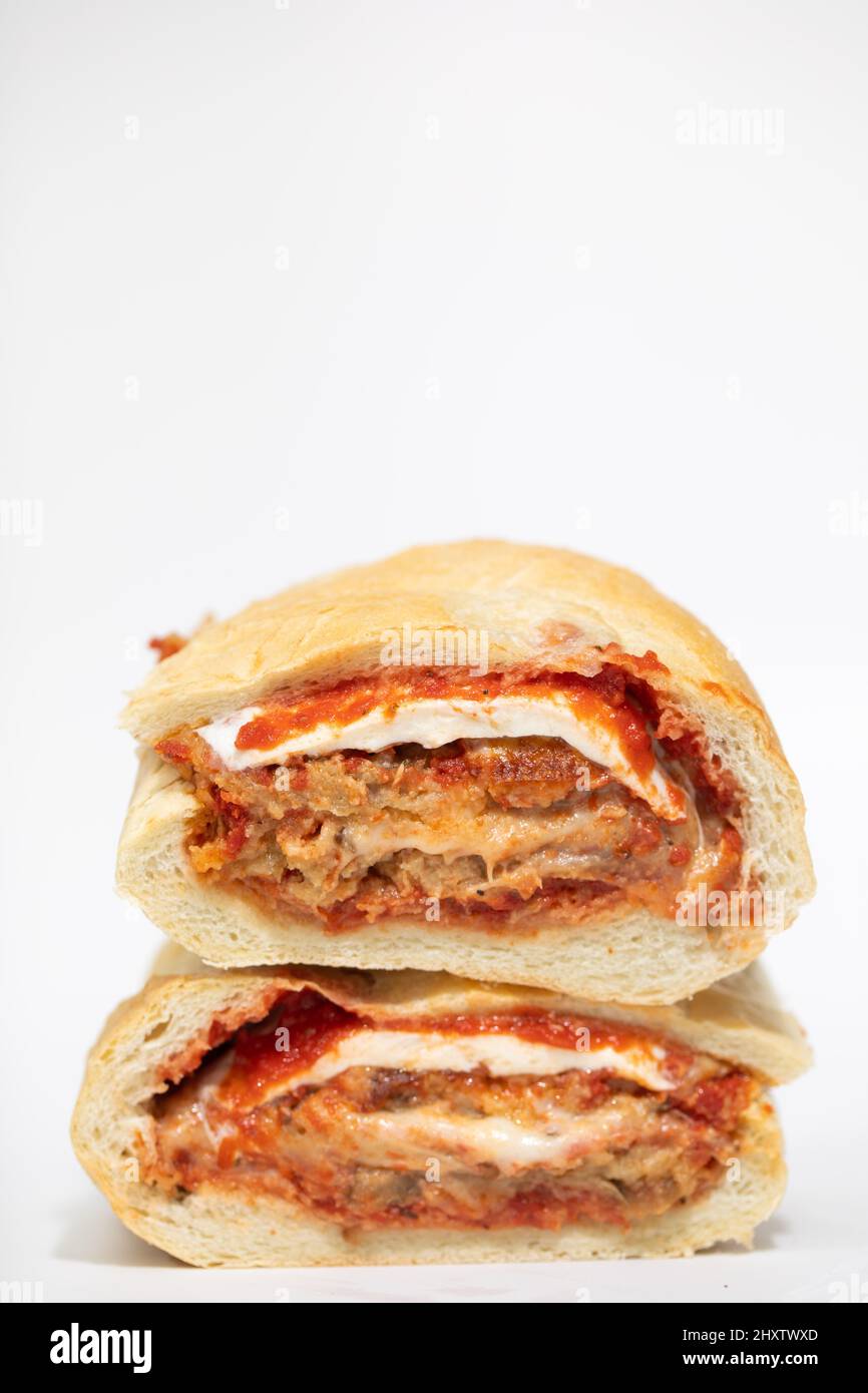 Vertical closeup of a delicious sandwich cut into two pieces isolated ...