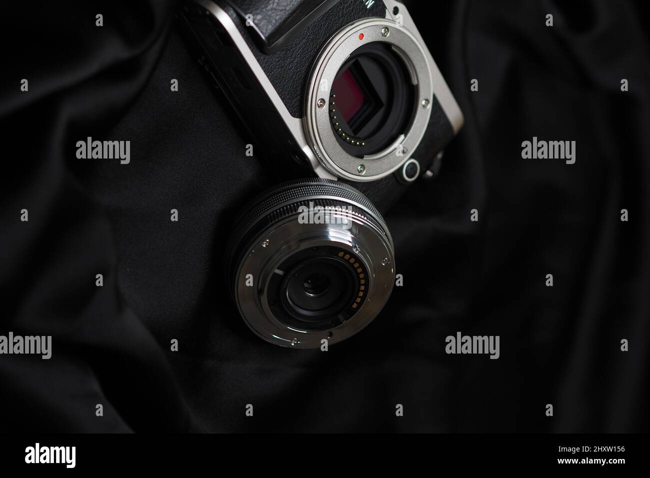 Closeup of a vintage camera on a black cloth Stock Photo - Alamy