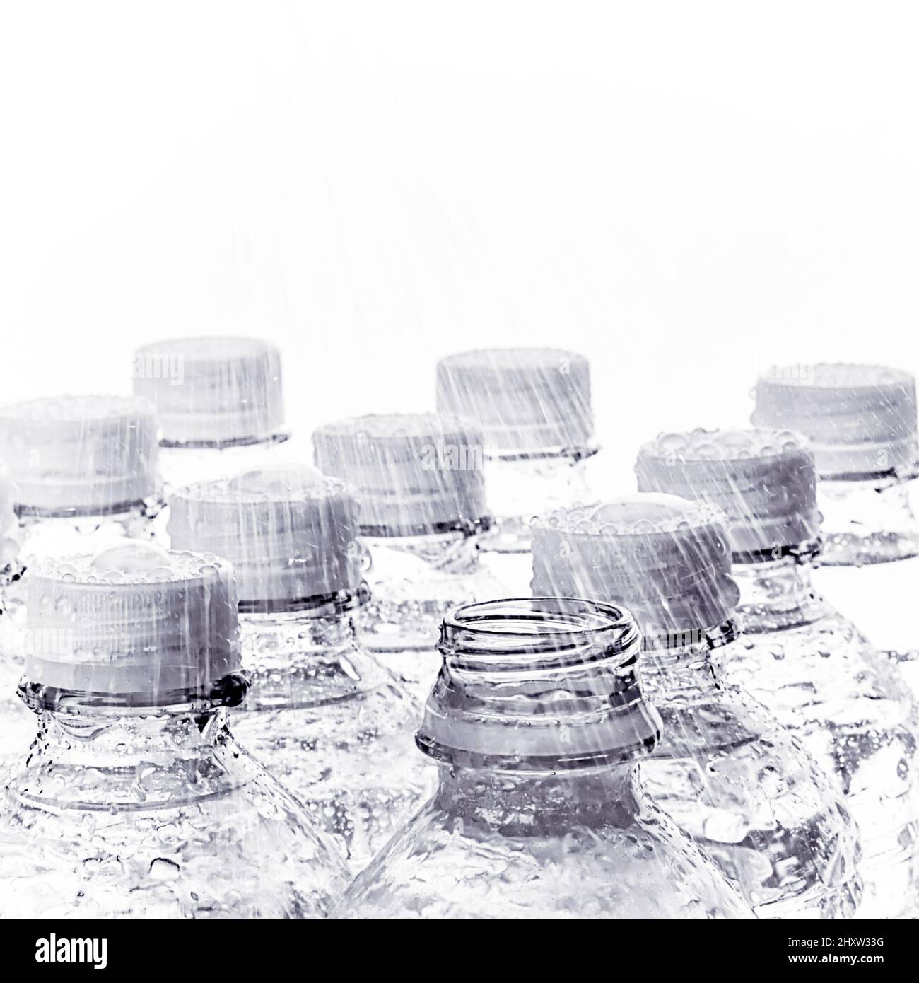 Bottled water with splashing Stock Photo - Alamy