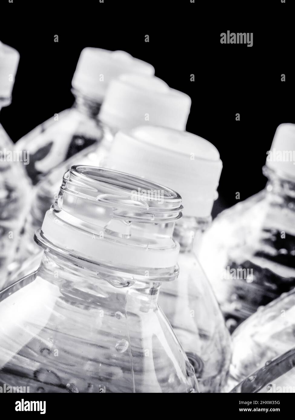 Bottled water with splashing Stock Photo - Alamy