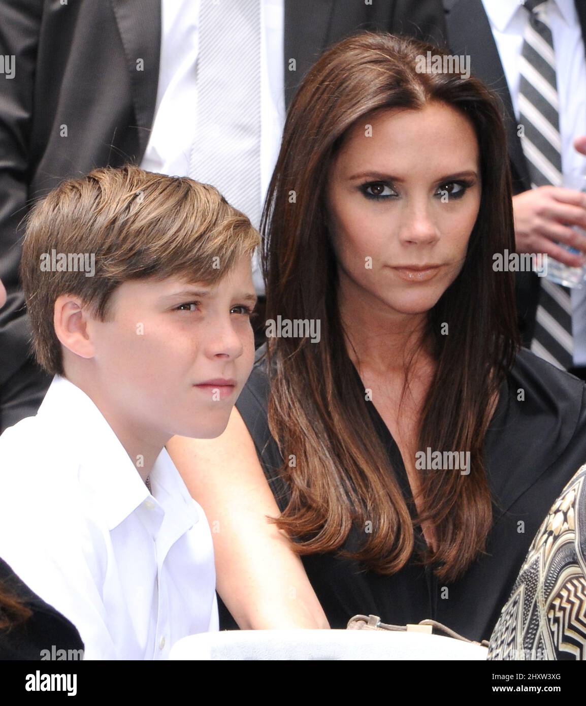 Brooklyn Beckham and Victoria Beckham at the ceremony celebrating Simon ...