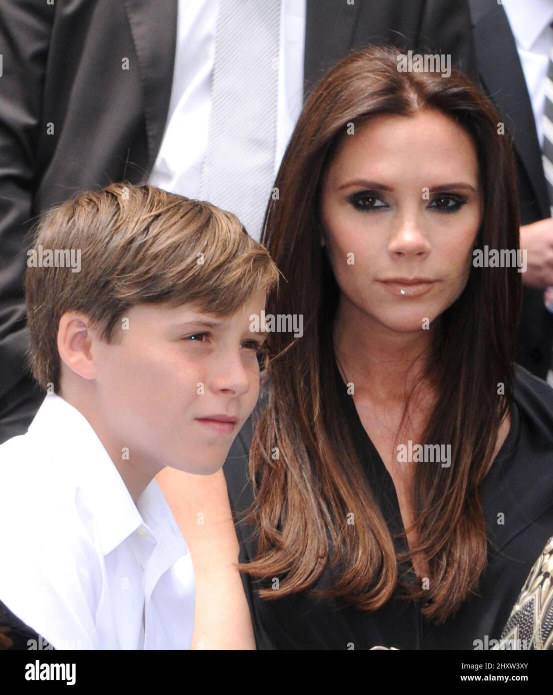 Brooklyn Beckham and Victoria Beckham at the ceremony celebrating Simon ...