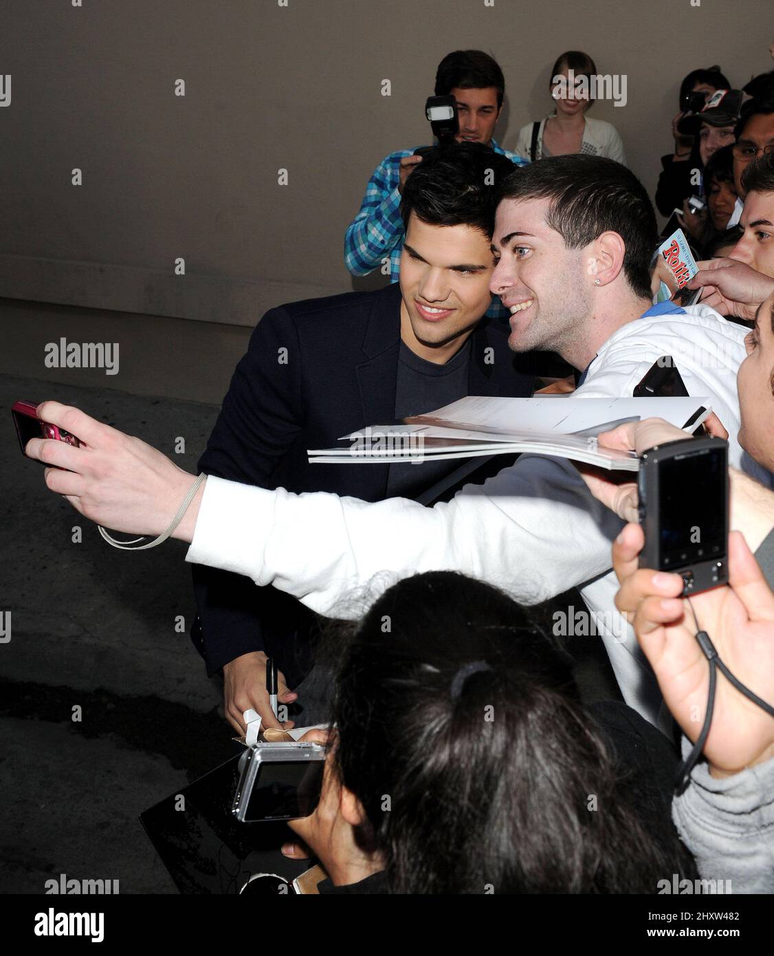Taylor Lautner signs autographs Outside Jimmy Kimmel Live in Los ...