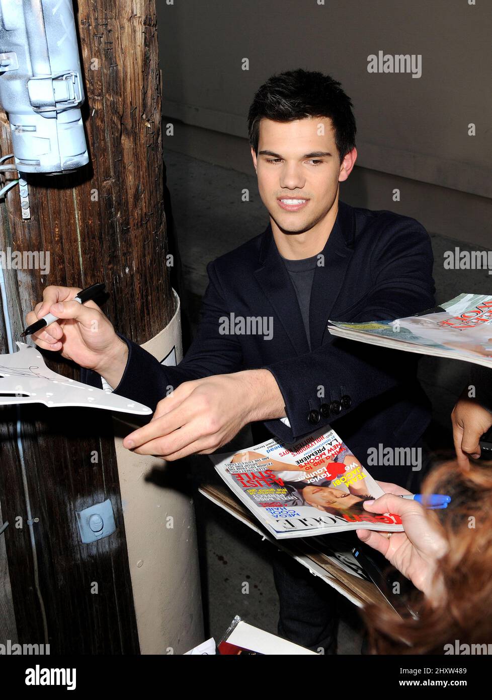 Taylor Lautner signs autographs Outside Jimmy Kimmel Live in Los ...