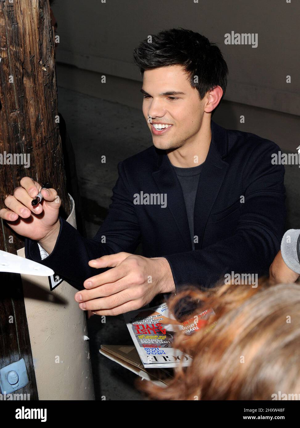 Taylor Lautner signs autographs Outside Jimmy Kimmel Live in Los ...