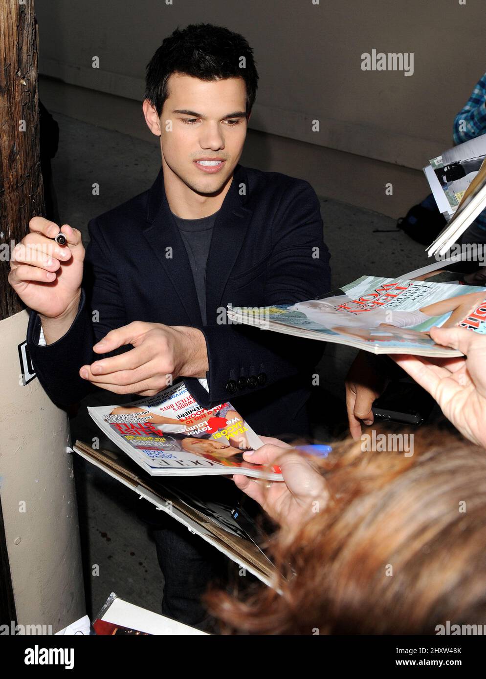 Taylor Lautner signs autographs Outside Jimmy Kimmel Live in Los ...