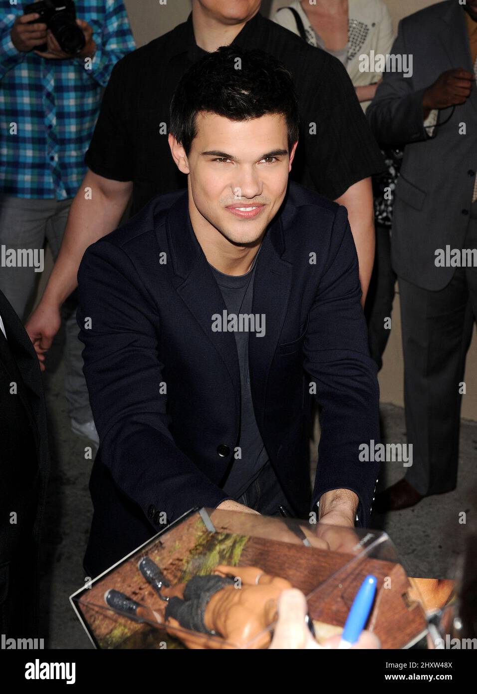 Taylor Lautner signs autographs Outside Jimmy Kimmel Live in Los ...