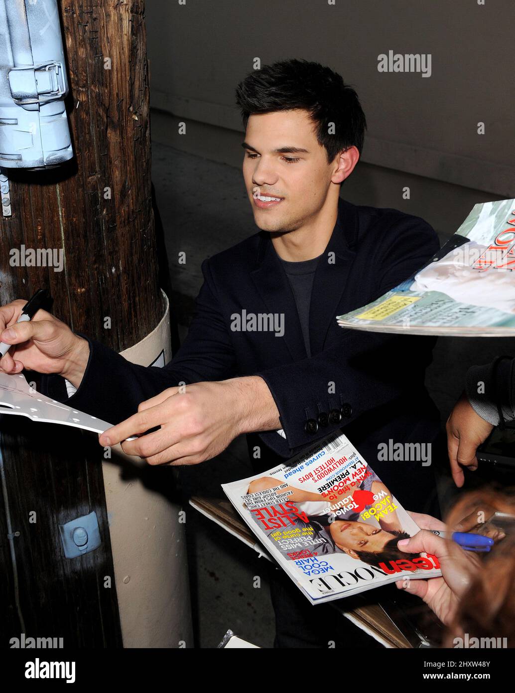 Taylor Lautner signs autographs Outside Jimmy Kimmel Live in Los ...