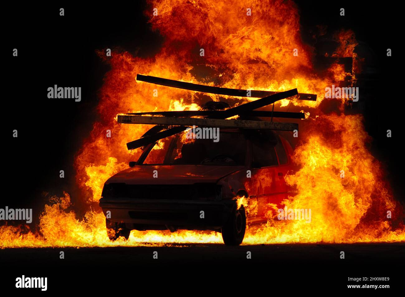 Car is driving through fire Stock Photo - Alamy