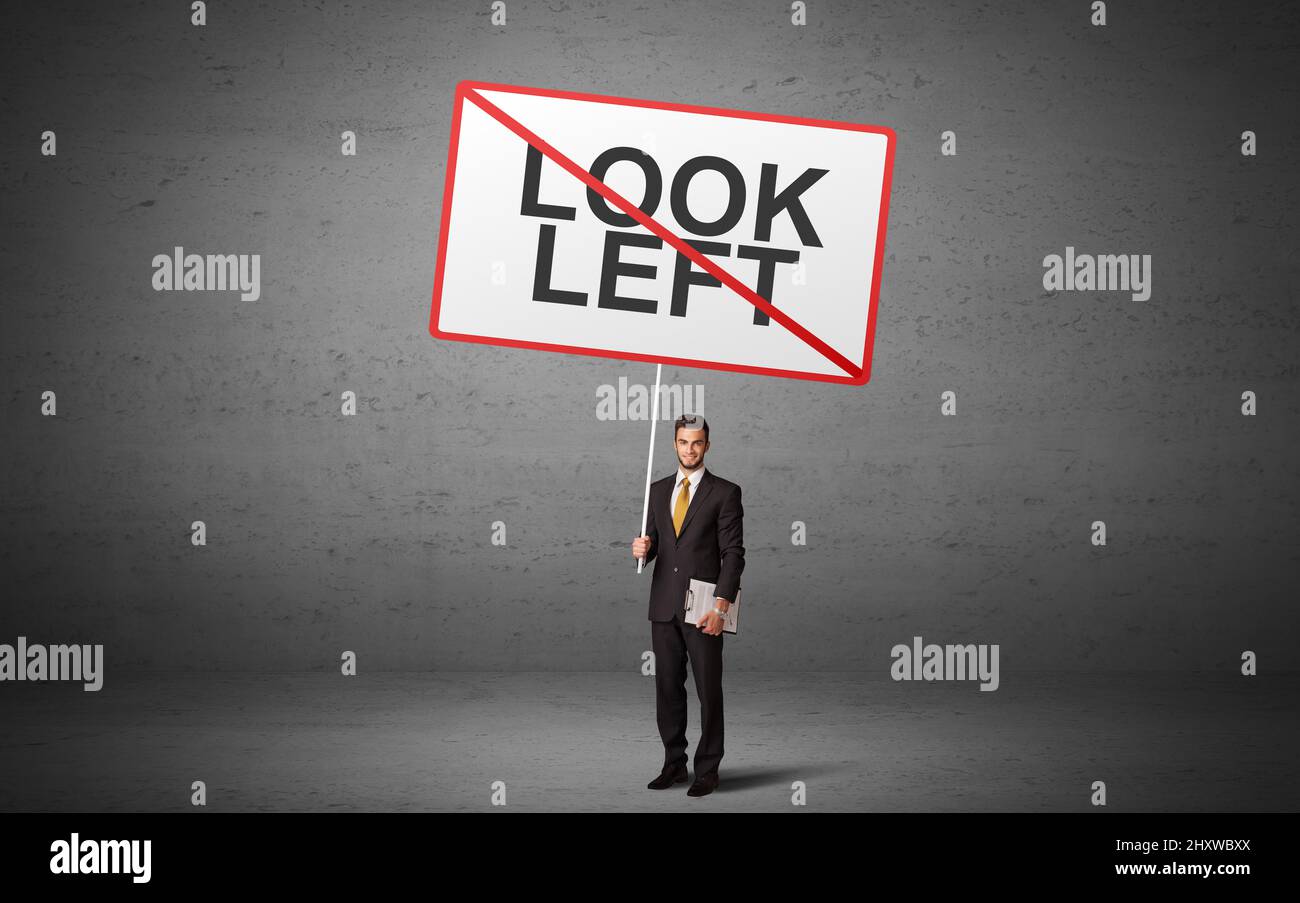 business person holding a traffic sign Stock Photo - Alamy