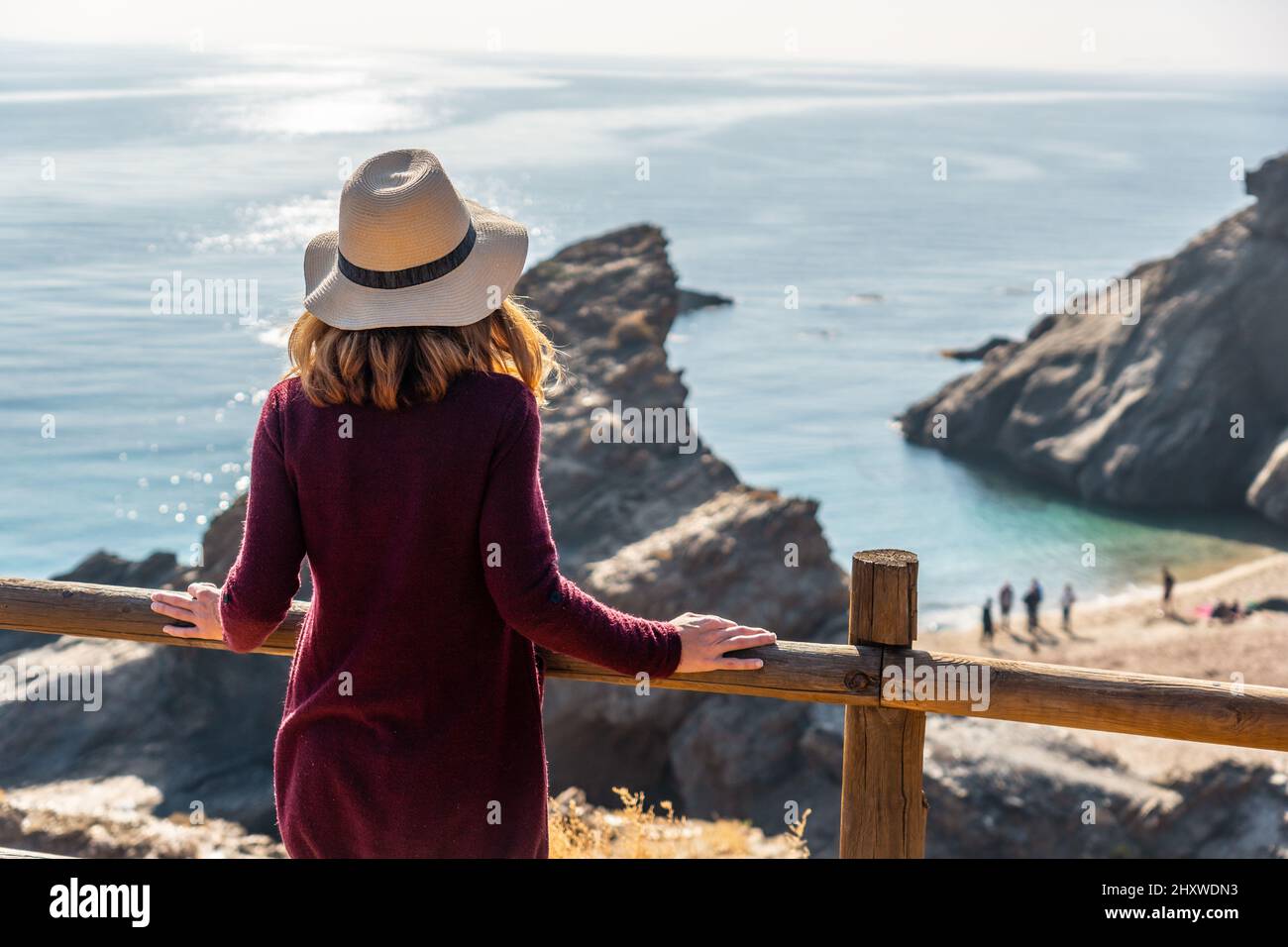 Young tourist looking at the beach in the Almanzora caves from above ...