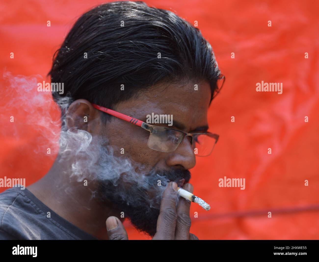 A man smoking a cigarette on ``No Smoking Day" in Agartala. No Smoking ...