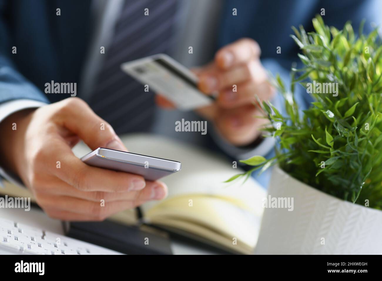 Mobile money suit hi-res stock photography and images - Alamy