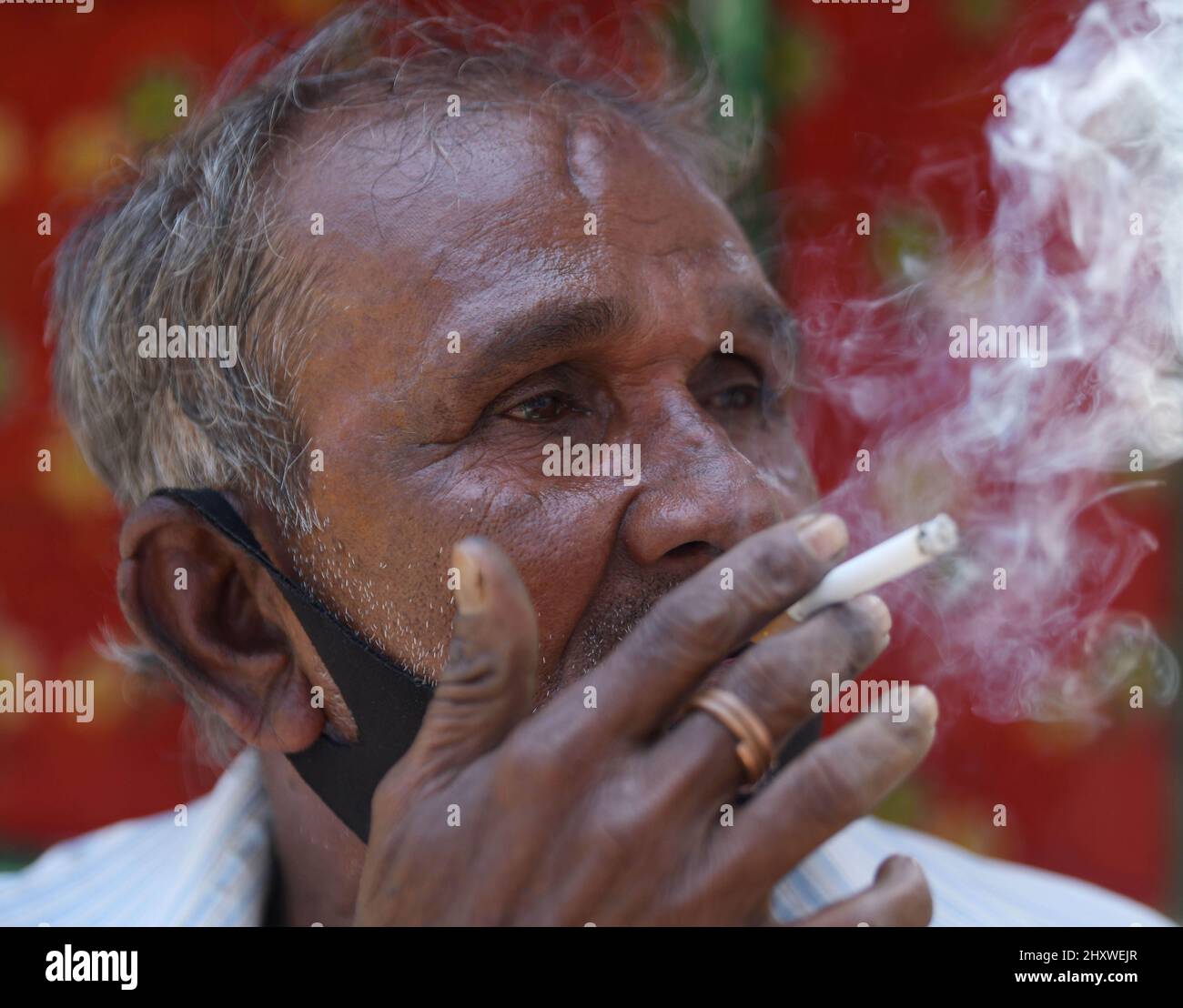 A man smoking a cigarette on ``No Smoking Day" in Agartala. No Smoking ...