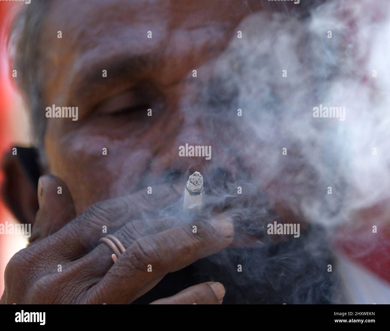 A man smoking a cigarette on ``No Smoking Day" in Agartala. No Smoking ...