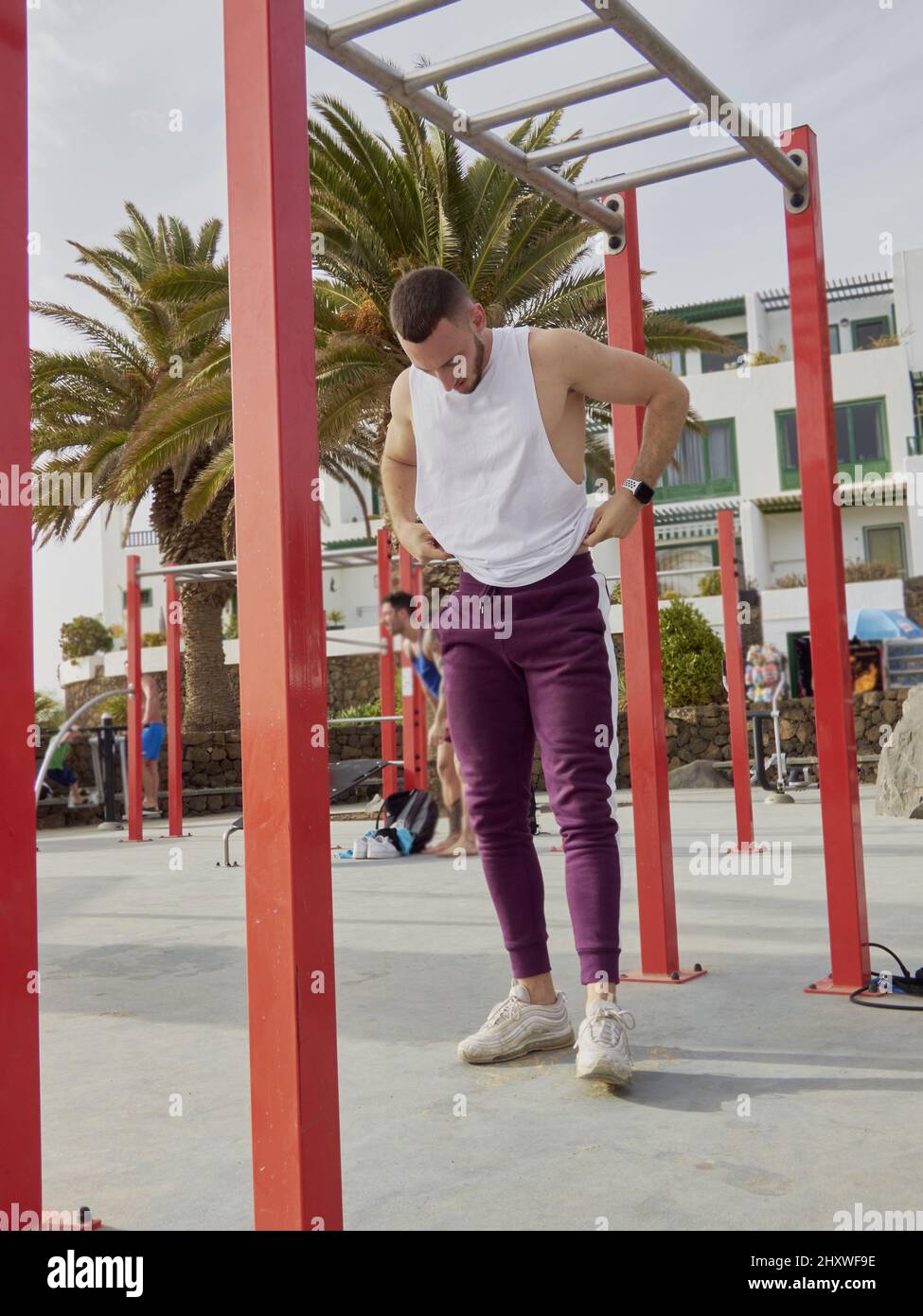 Photo of a man working out on the playground during the daytime Stock ...
