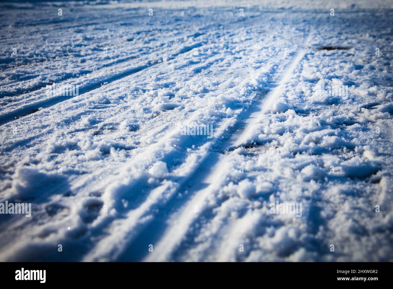 Perspective of a snow road with ice Stock Photo - Alamy
