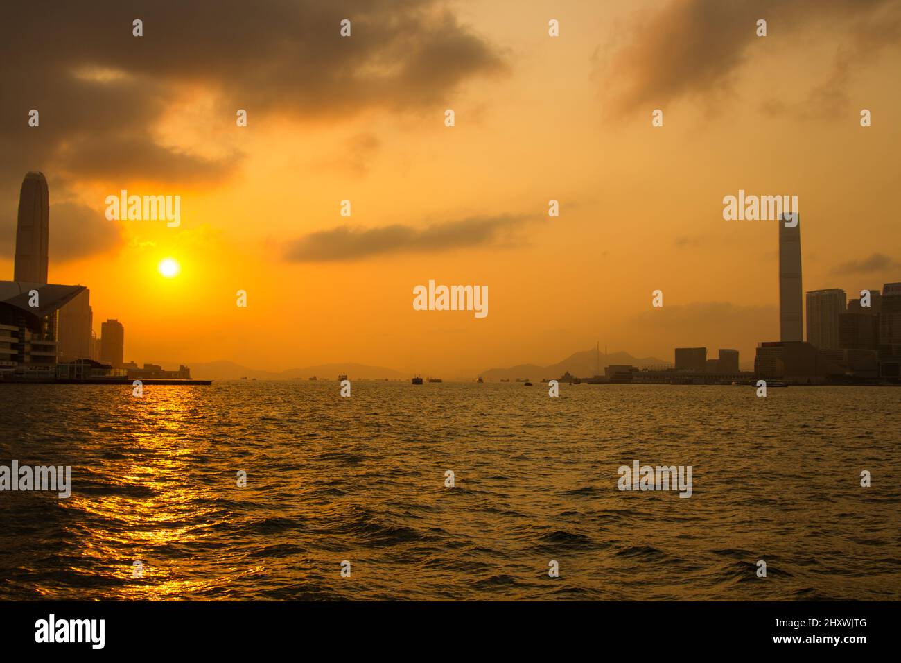 View of Victoria Harbor at sunset. Hong Kong Stock Photo - Alamy