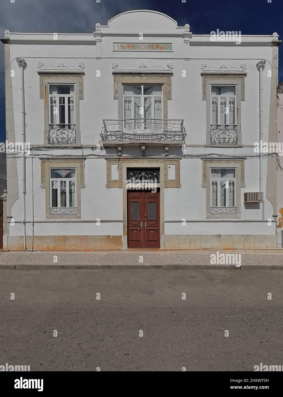 Neoclassical house-white facade-metal railing-balcony and balconets ...