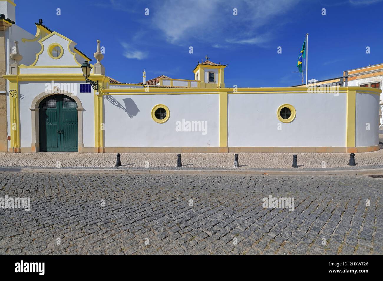 Whitewashed wall-yellow edge line-Brazilian consulate wall and flag ...