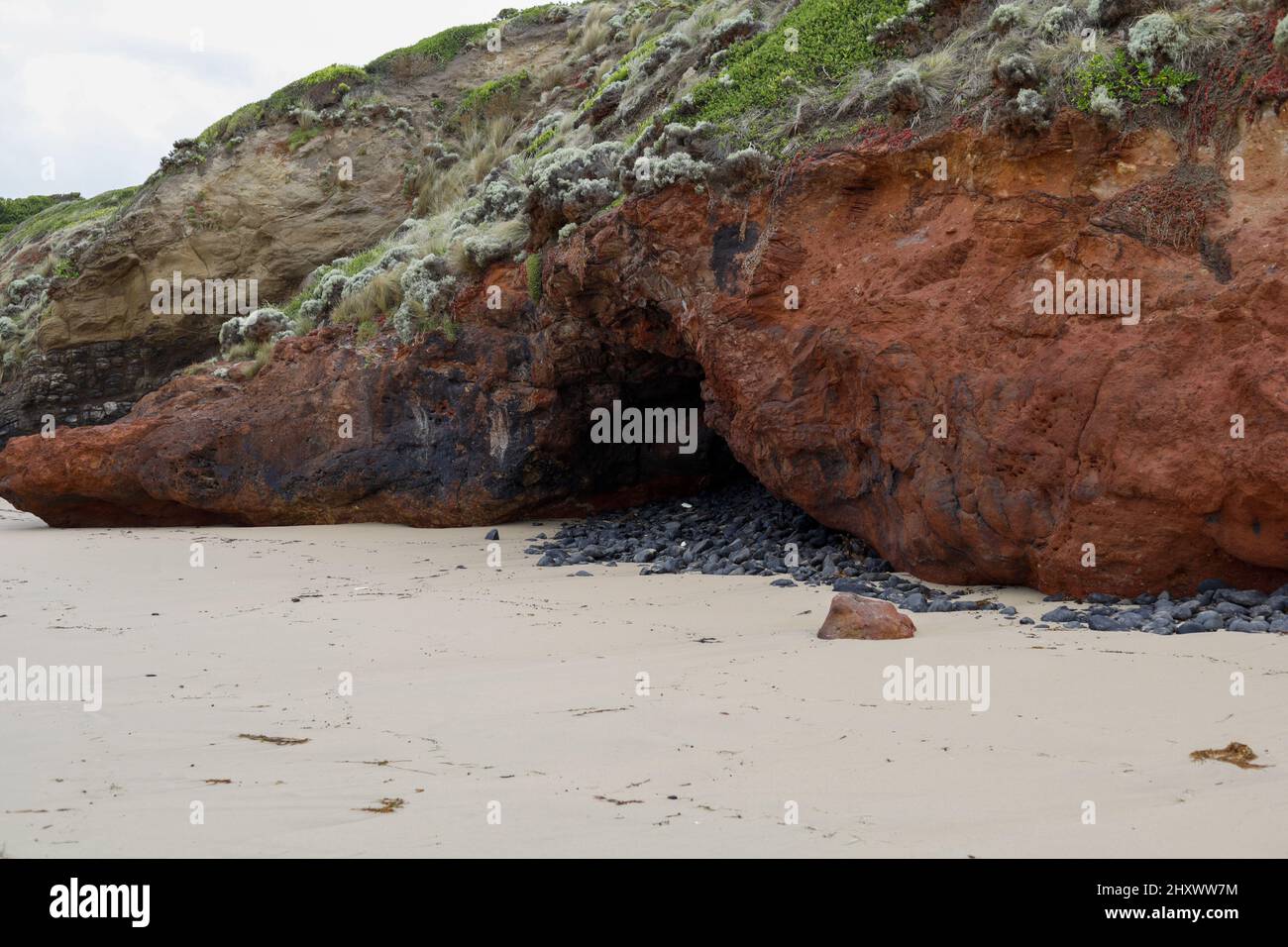 Big rock on a beach in Melbourne Stock Photo - Alamy