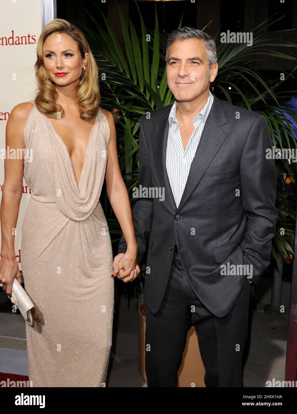 Stacy Keibler and George Clooney attending "The Descendants" Premiere ...