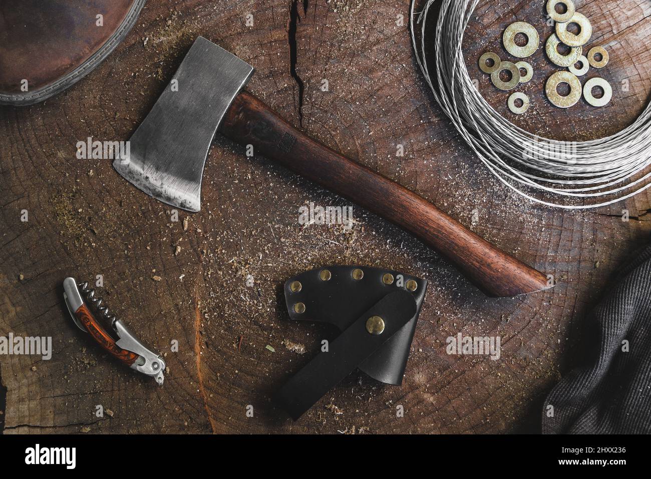 Top view of a hatchet on a tree stump with accessories Stock Photo - Alamy