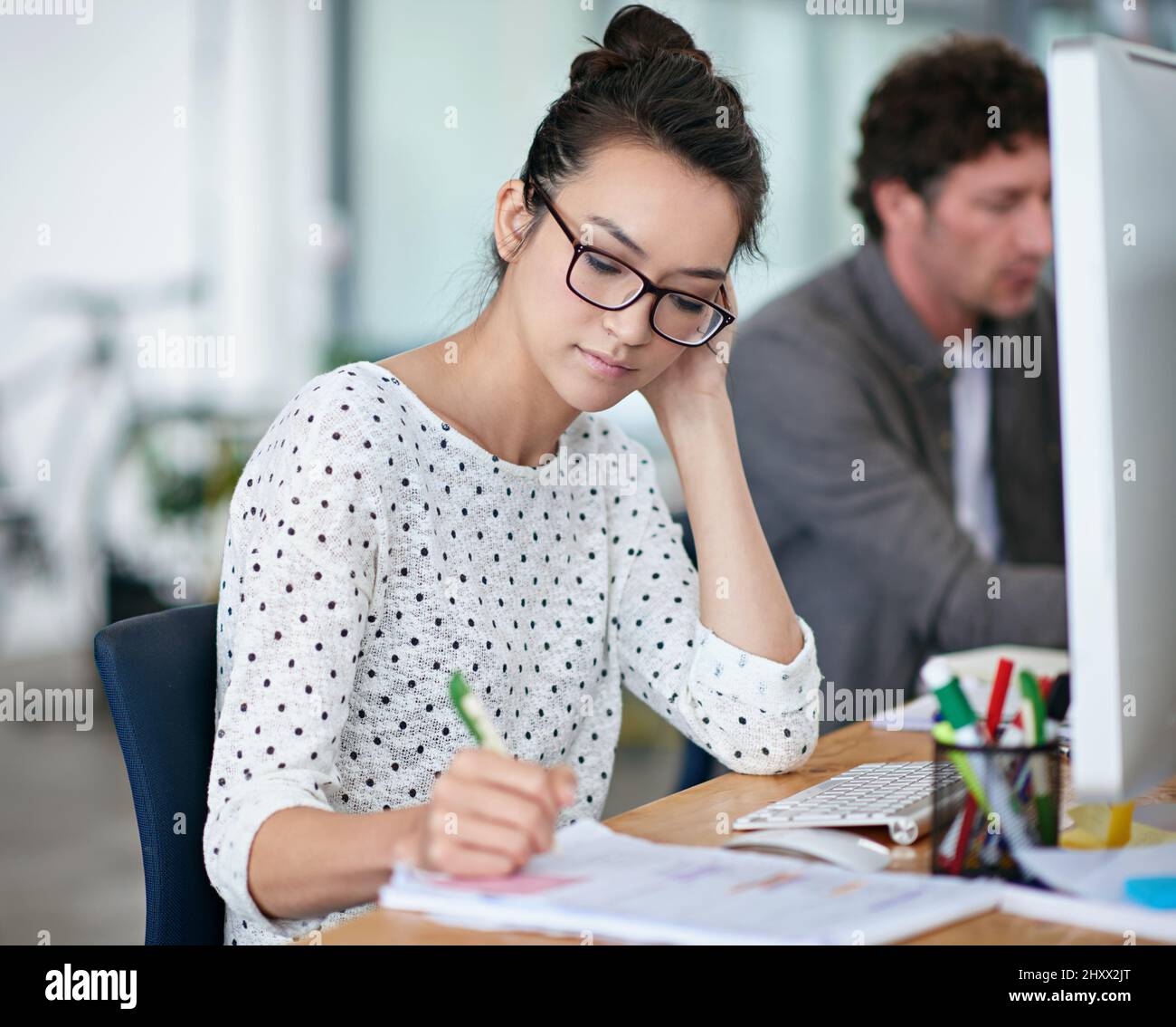 Focused on creating a winning design. Shot of a beautiful young woman ...