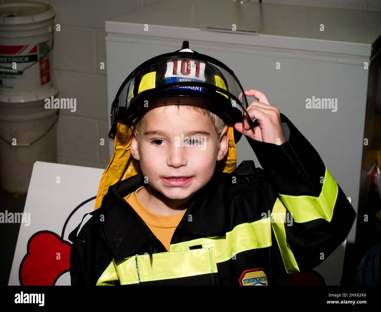 Aspiring firefighter kid Stock Photo - Alamy