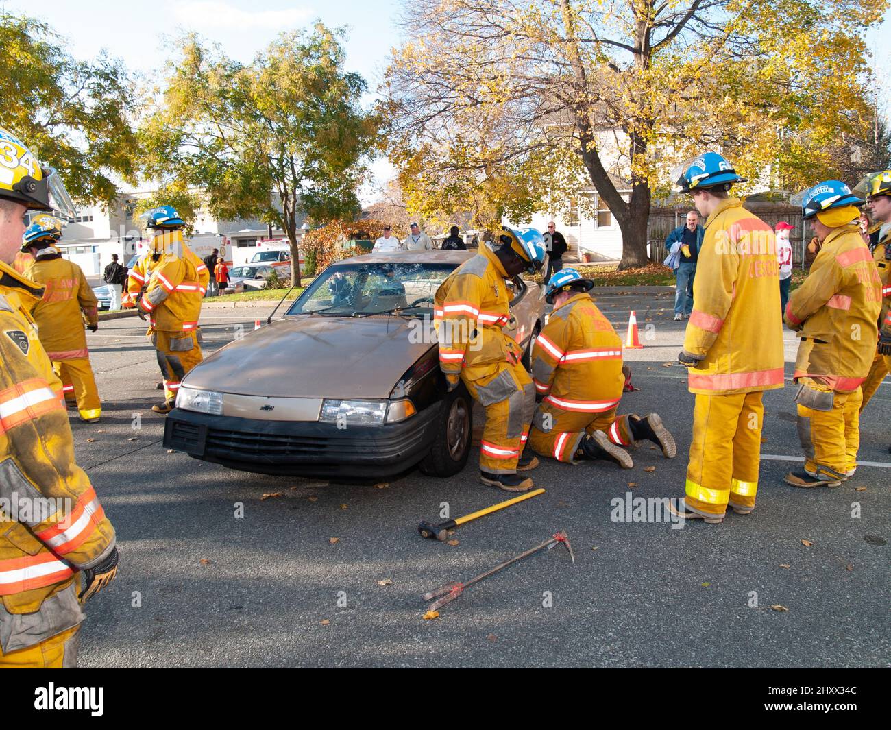 Rescue worker with wrecked car during drill Stock Photo - Alamy
