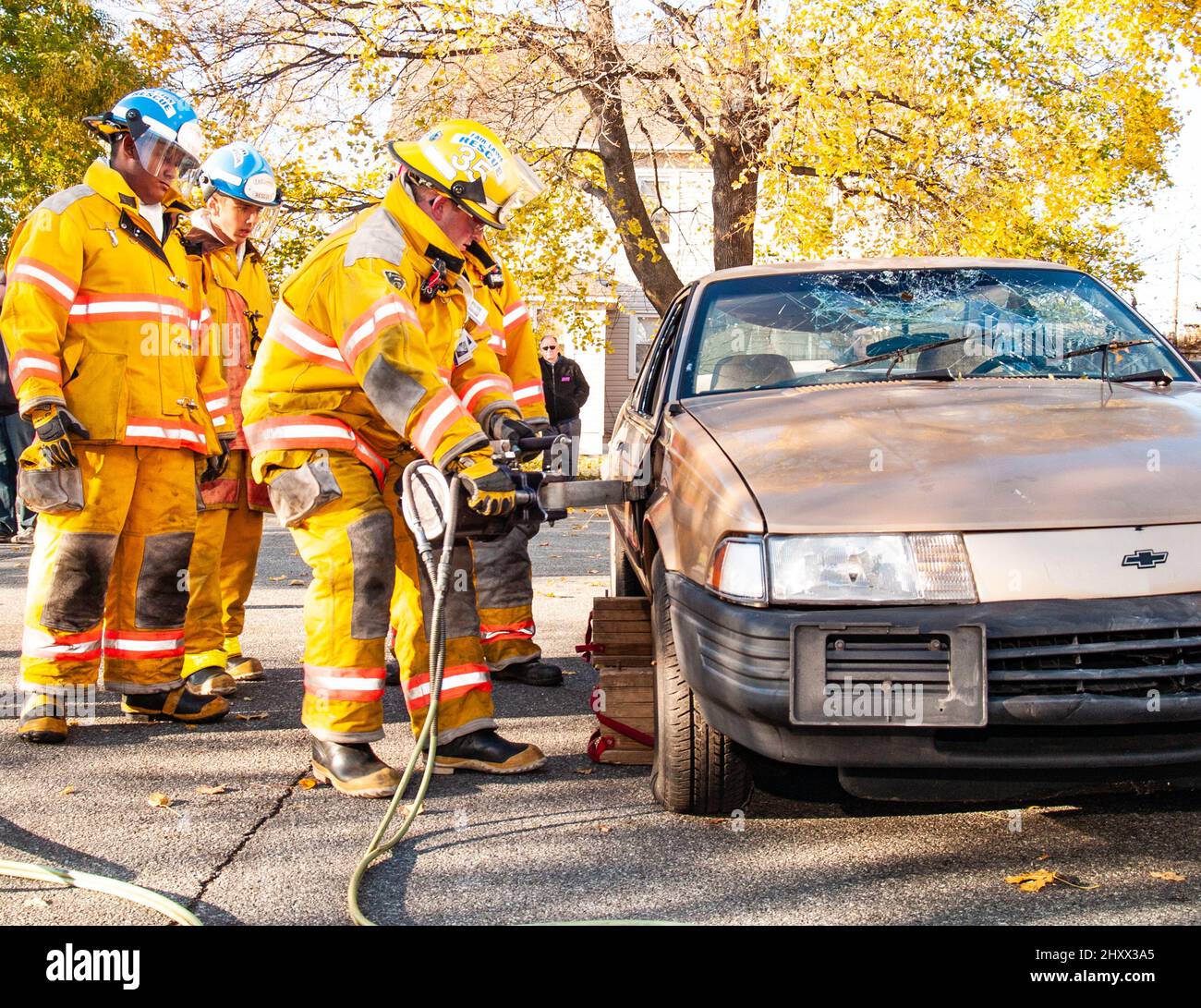 Rescue worker with wrecked car during drill Stock Photo - Alamy