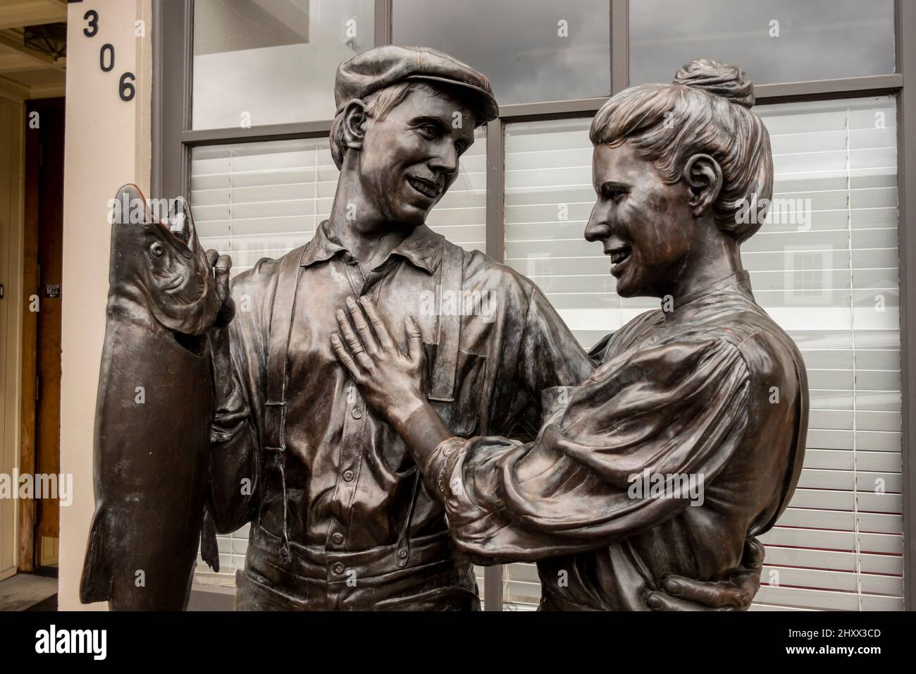 Tacoma, WA USA - circa August 2021: Statue of a husband showing a fish ...