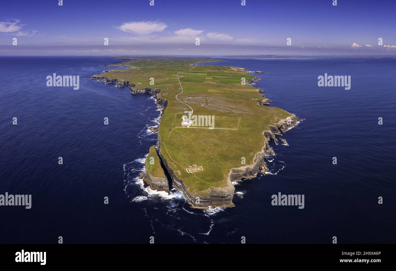aerial view of the Loophead Lighthouse on the land in Kilbaha, Ireland ...